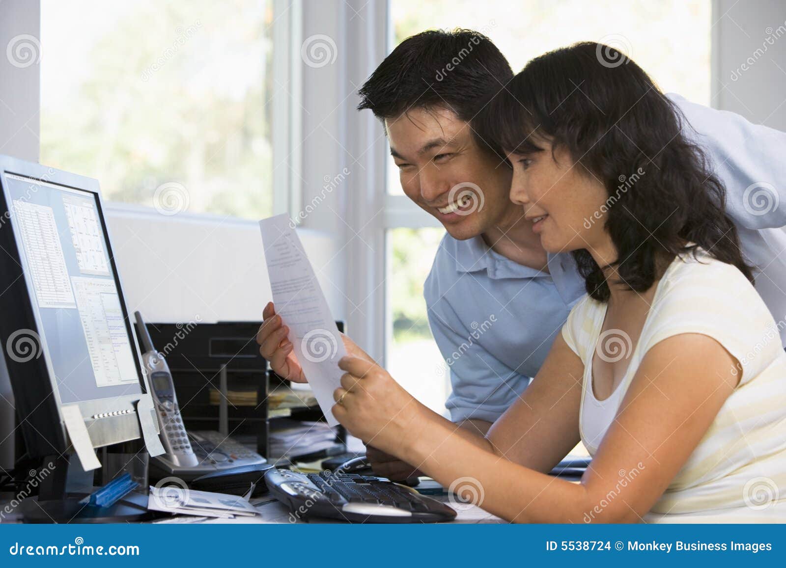 Couple in Home Office with Computer and Paperwork Stock Photo - Image ...