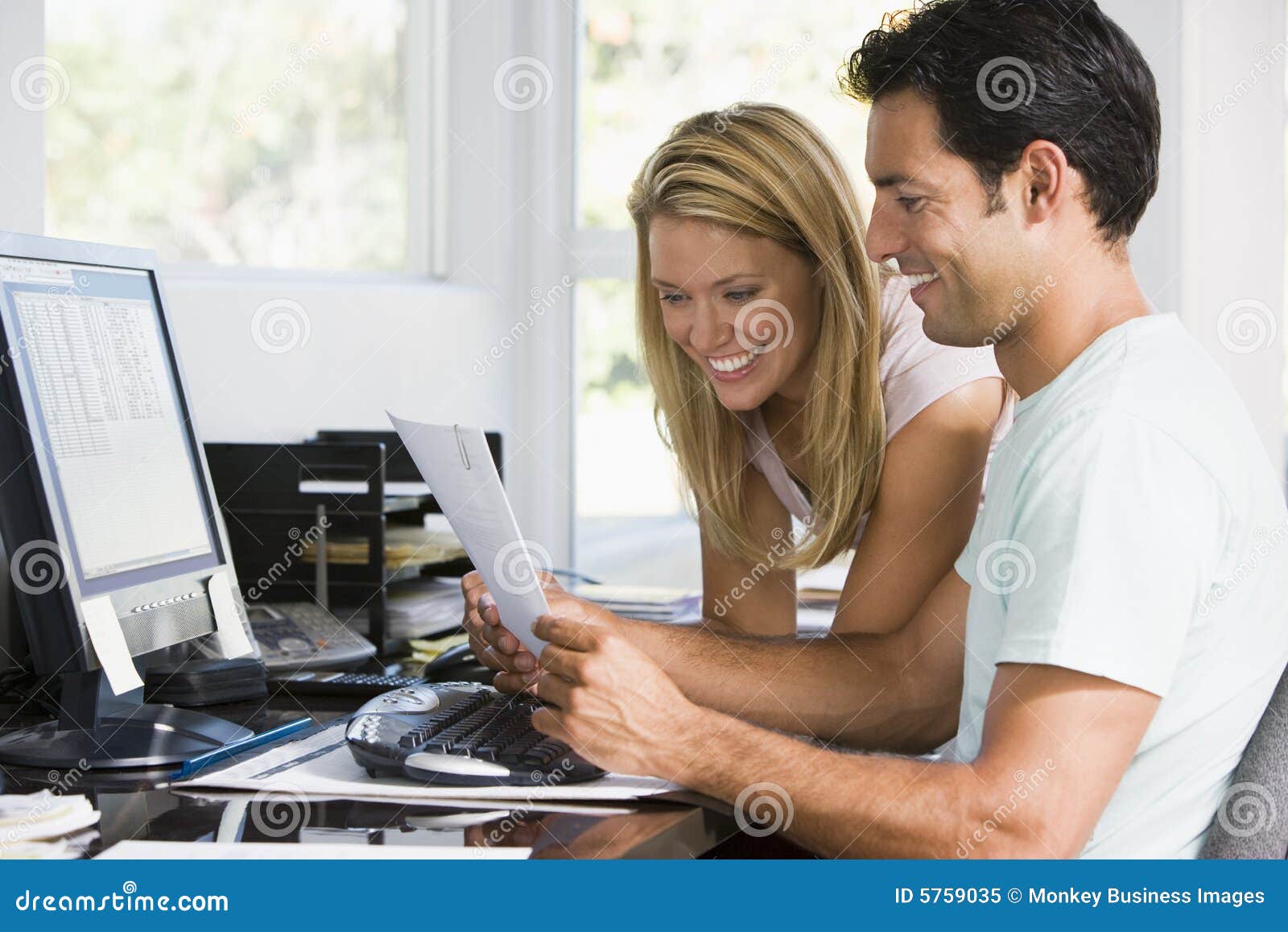 Couple in Home Office with Computer and Paperwork Stock Image - Image ...