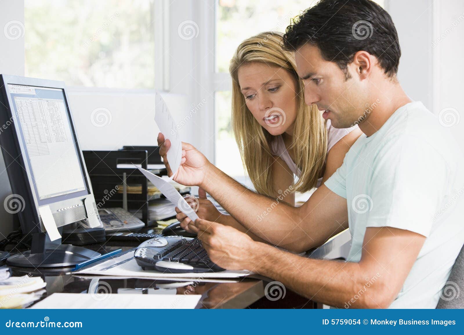 Couple in Home Office with Computer and Paperwork Stock Photo - Image ...