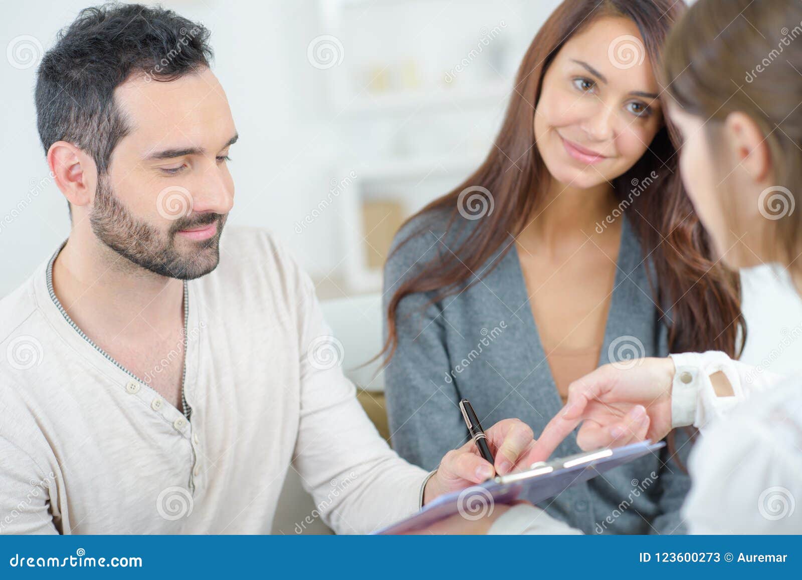Couple at Home Signing Paper Stock Image - Image of girl, vsitor: 123600273