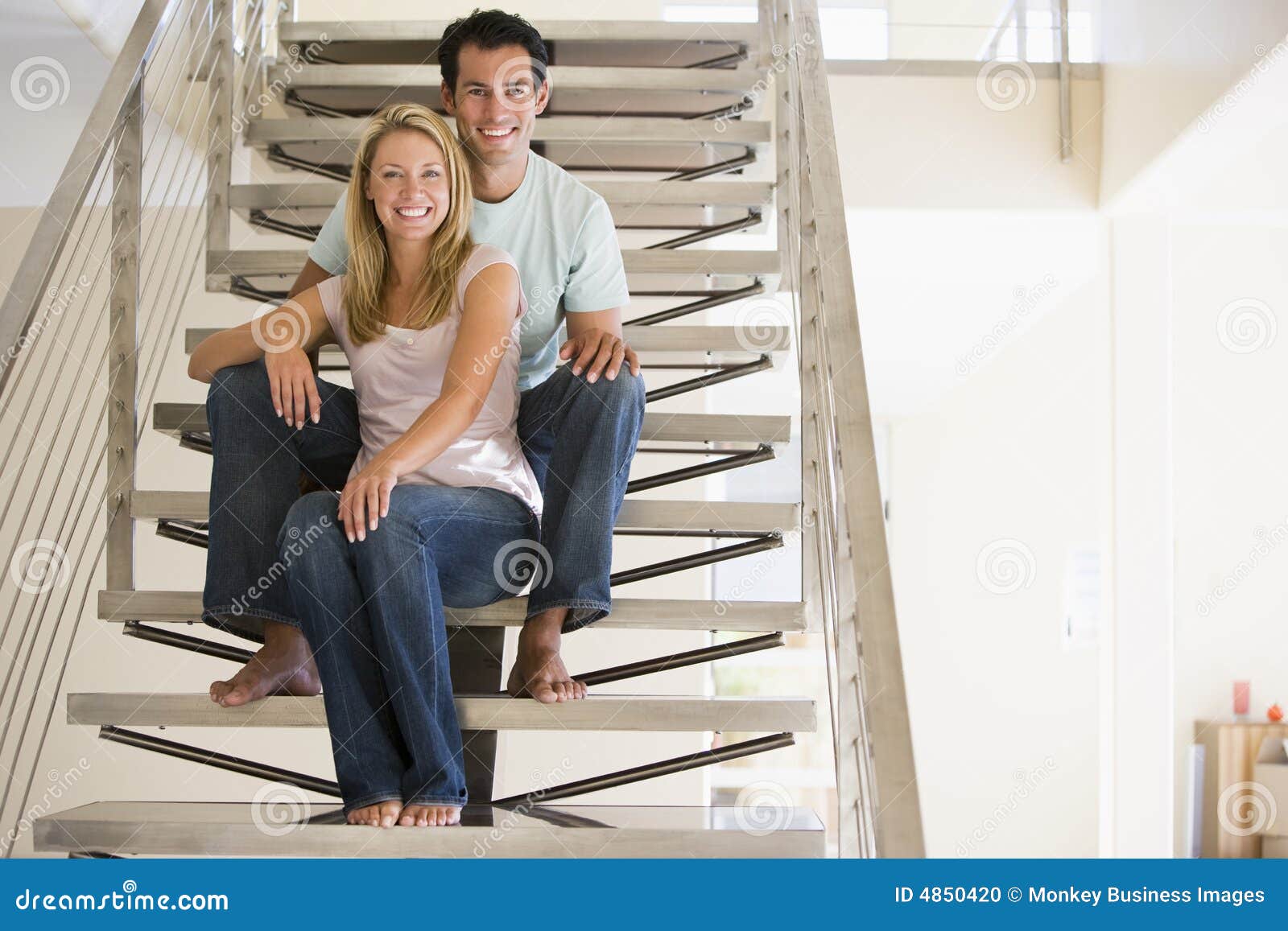Couple at Home Sitting on Stairs Stock Photo - Image of female, male ...