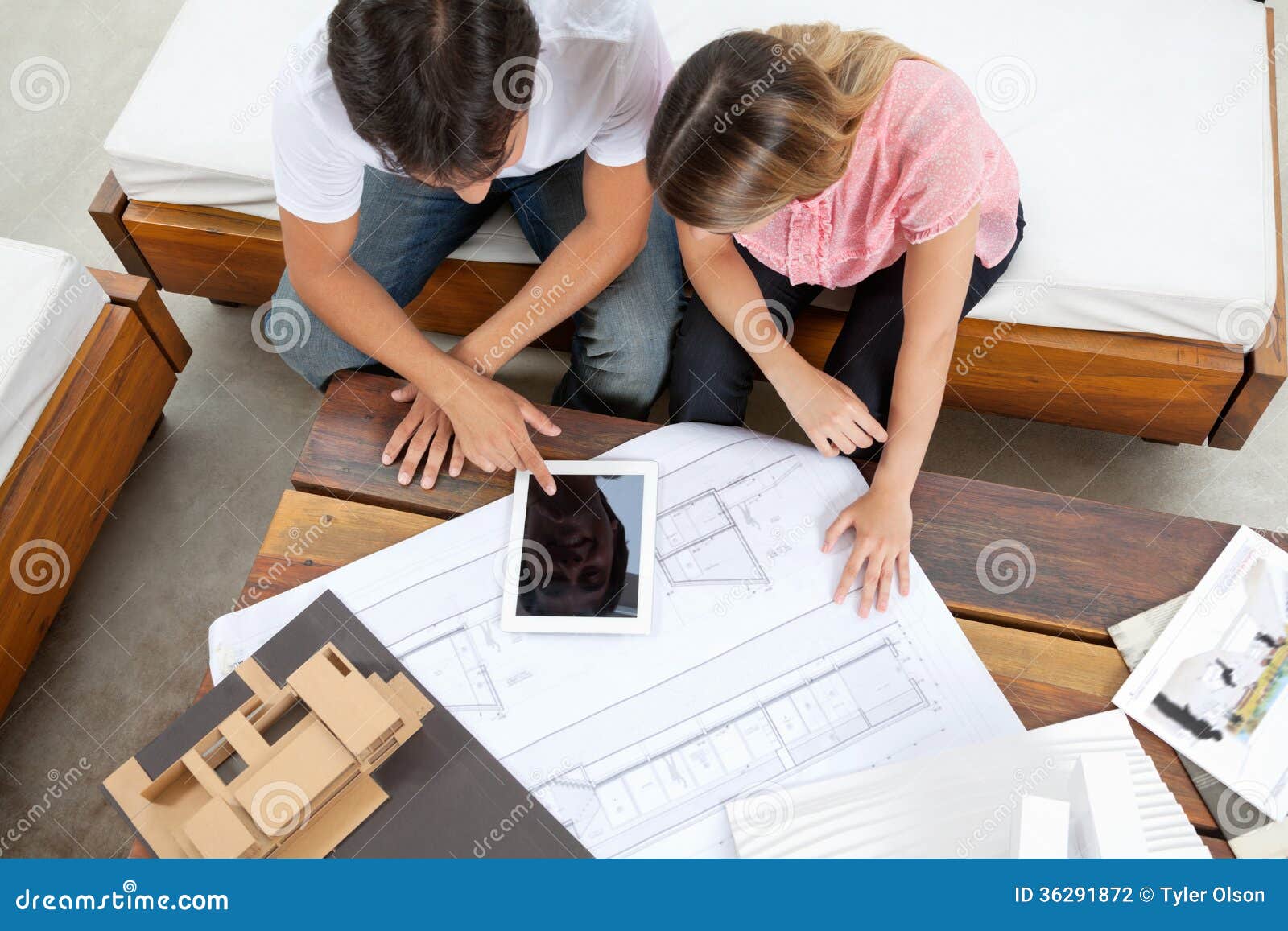Couple with House Plans stock photo. Image of drawing - 36291872