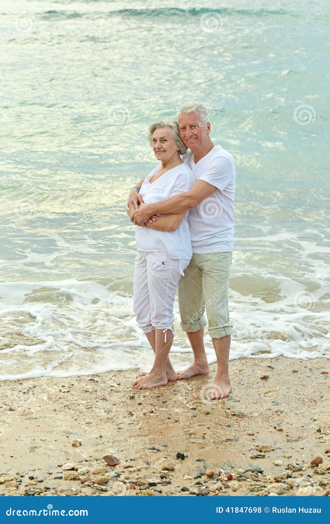 Couple hugging on beach stock photo. Image of happiness - 41847698