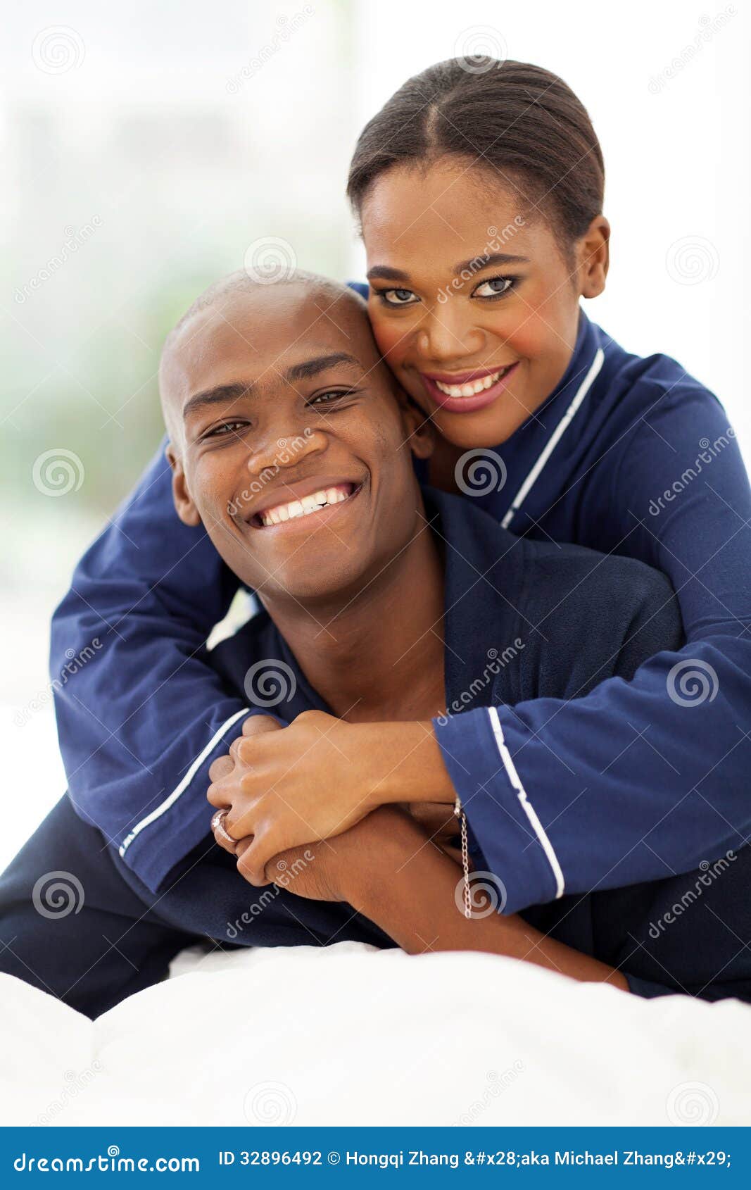 Couple hugging bed stock photo. Image of female, love - 32896492