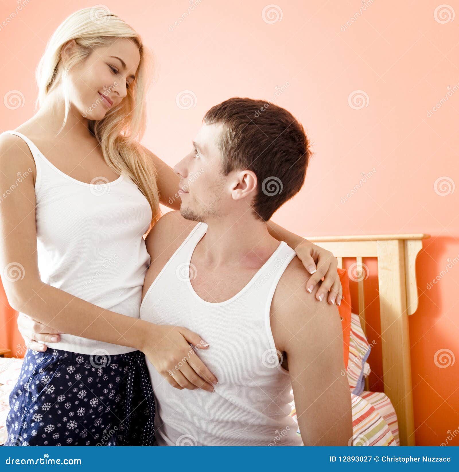Couple Hugging in Bedroom stock image. Image of long - 12893027