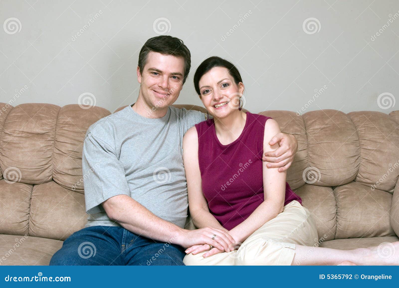 Couple Hugging on the Couch - Horizontal Stock Photo - Image of ...