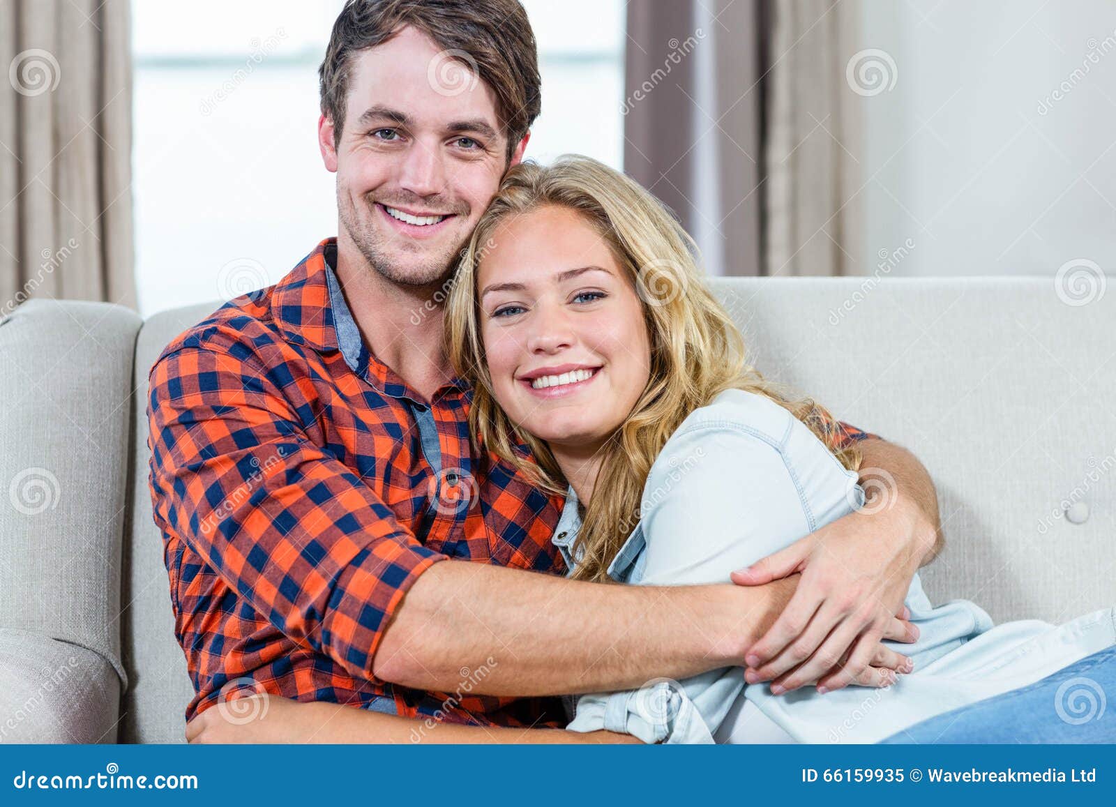 Couple Hugging on the Couch Stock Image - Image of domestic, household ...