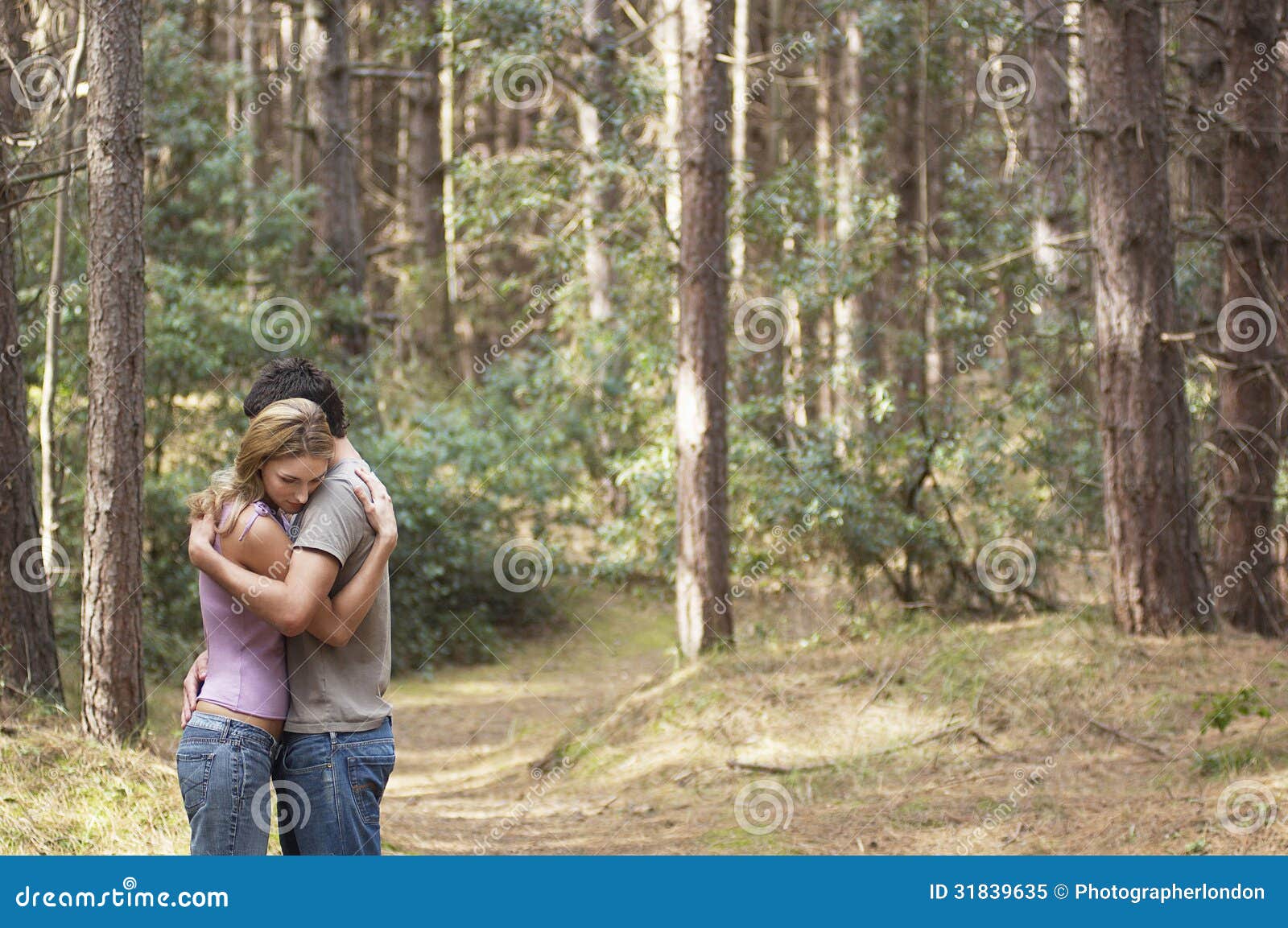 Couple Hugging in Forest stock image. Image of male, blurred - 31839635