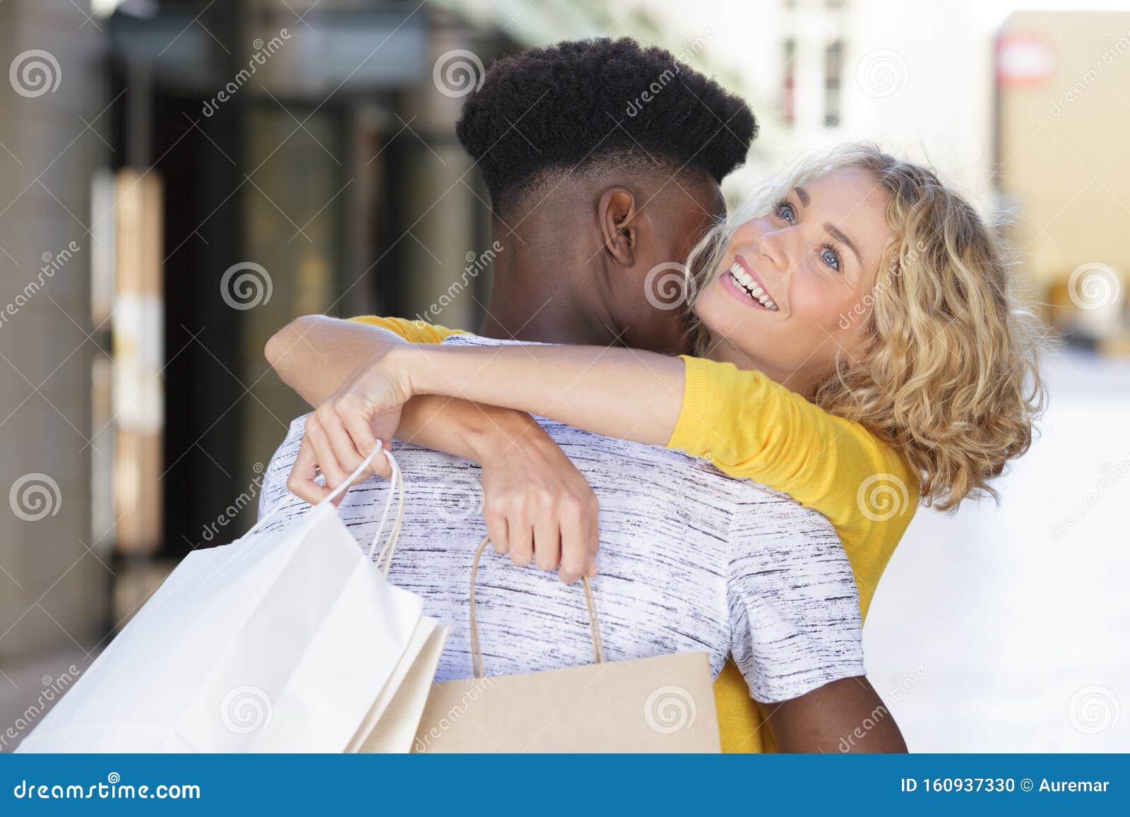 Couple Hugging and Holding Shopping Bags Stock Photo - Image of credit ...