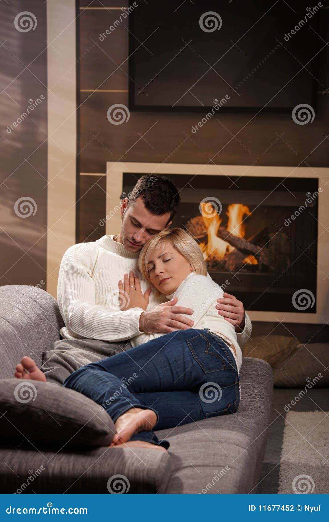 Couple hugging home stock photo. Image of blanket, fireplace - 11677452