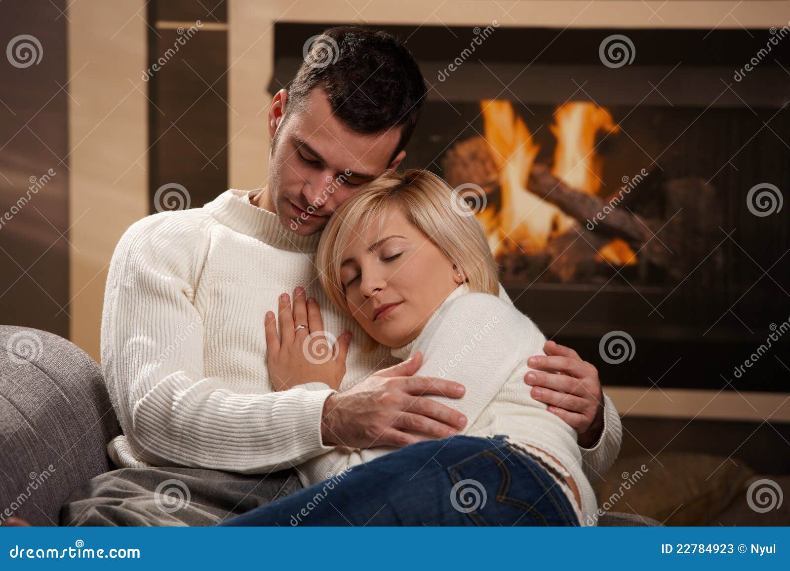 Couple hugging home stock image. Image of cuddling, fireplace - 22784923