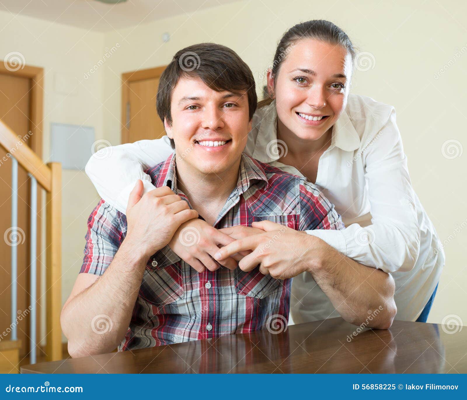 Couple hugging at home stock image. Image of embracing - 56858225