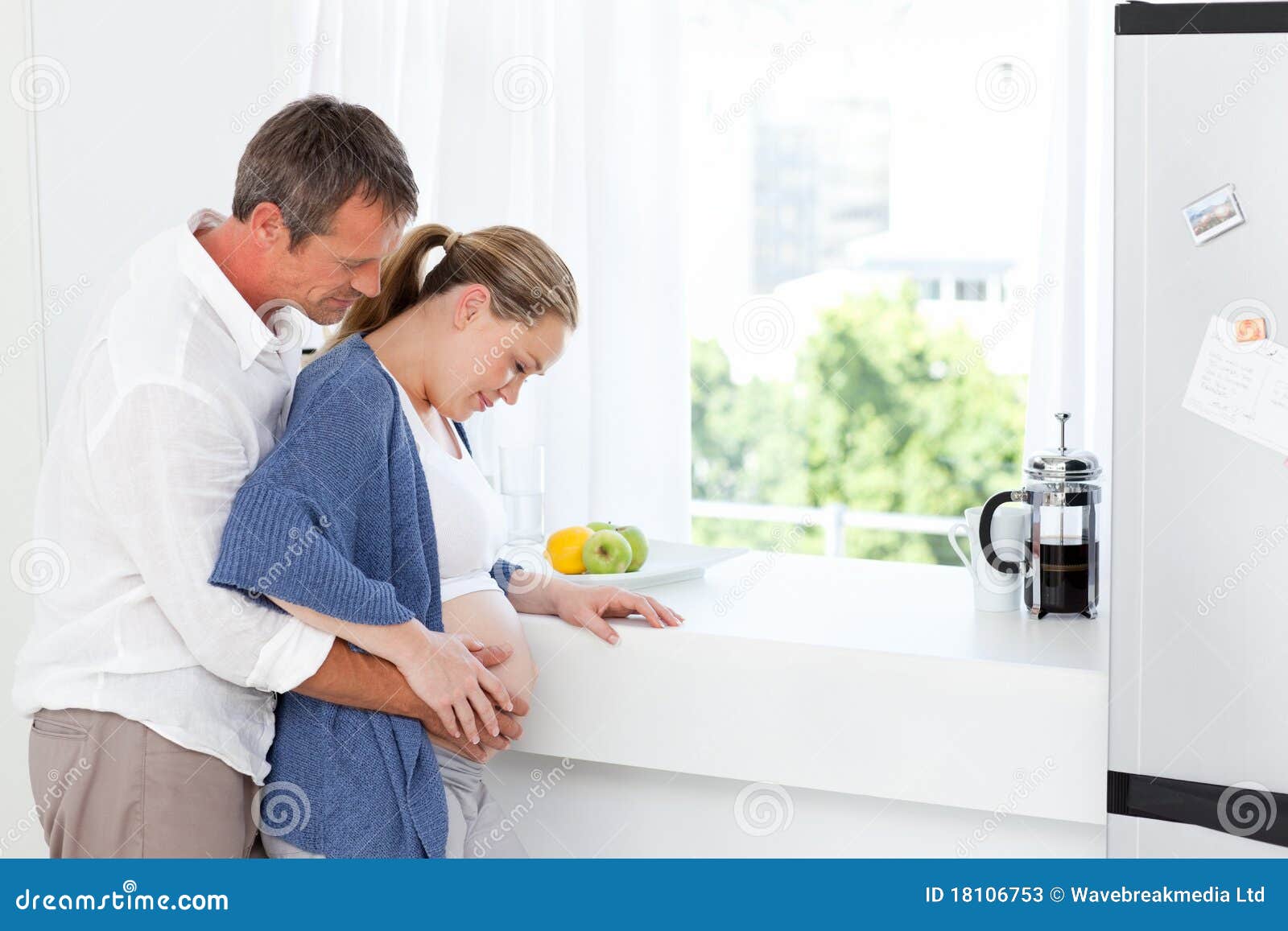 Couple Hugging in the Kitchen Stock Image - Image of parenting, posing ...