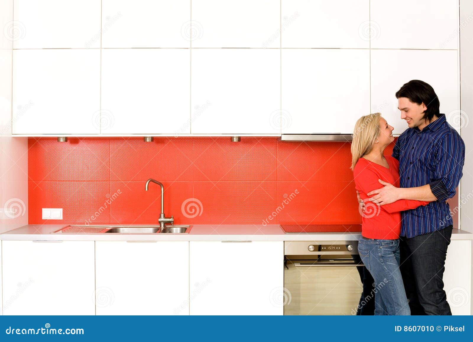 Couple hugging in kitchen stock photo. Image of flat, smiling - 8607010