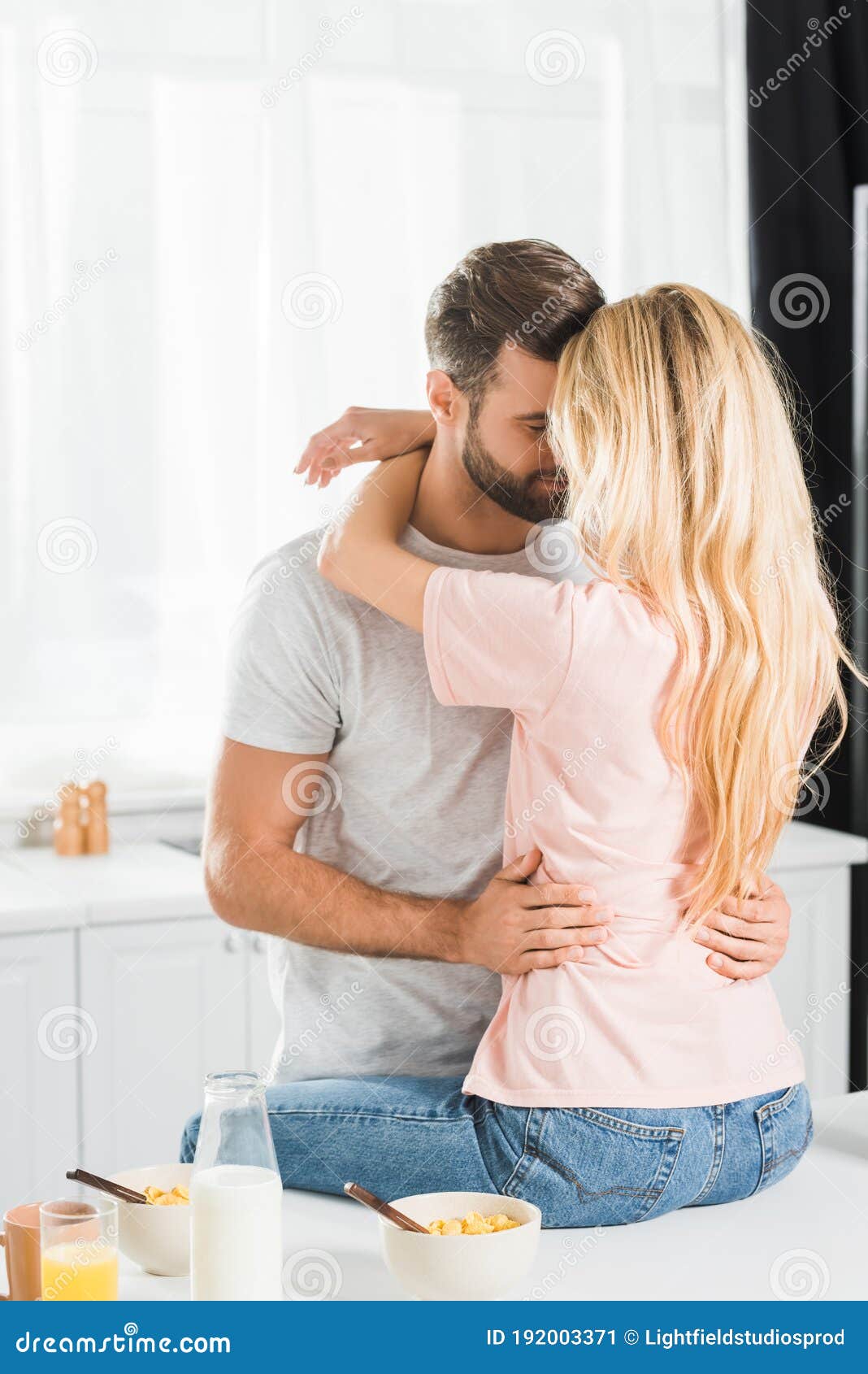 Couple Hugging on Kitchen Counter during Breakfast Stock Image - Image ...