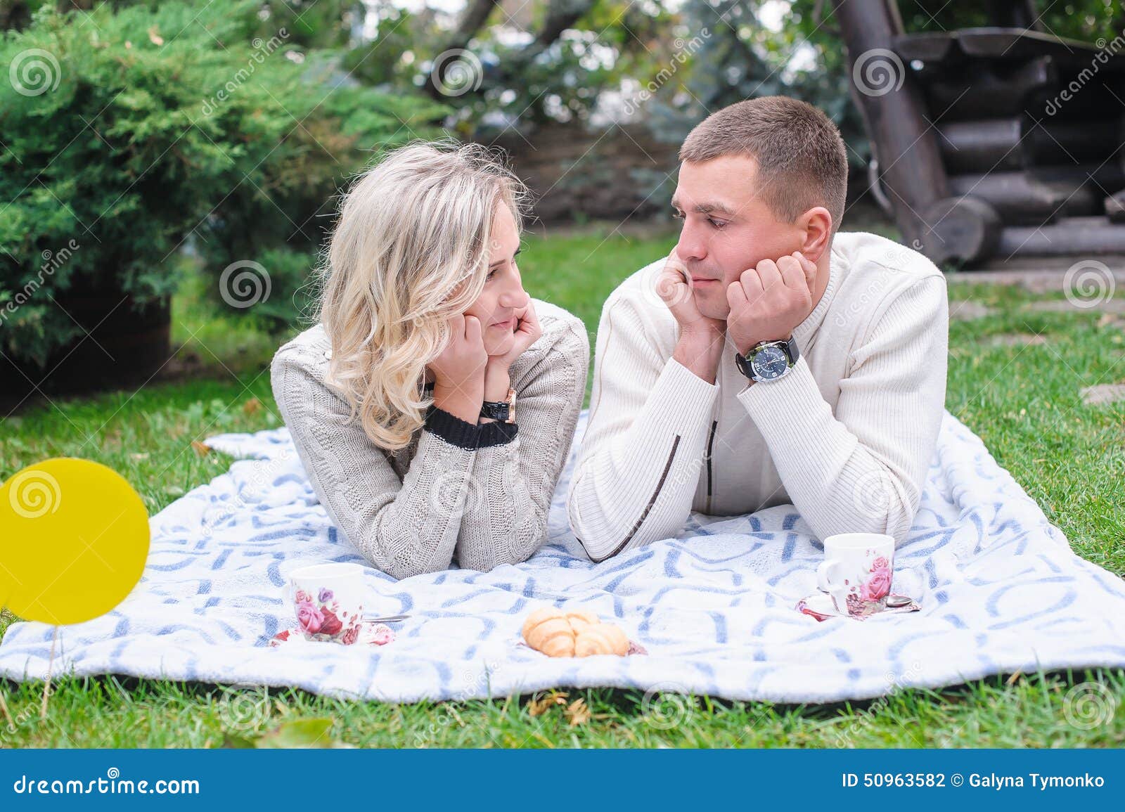 Couple Hugging in a Park Seated in a Bench Stock Photo - Image of ...