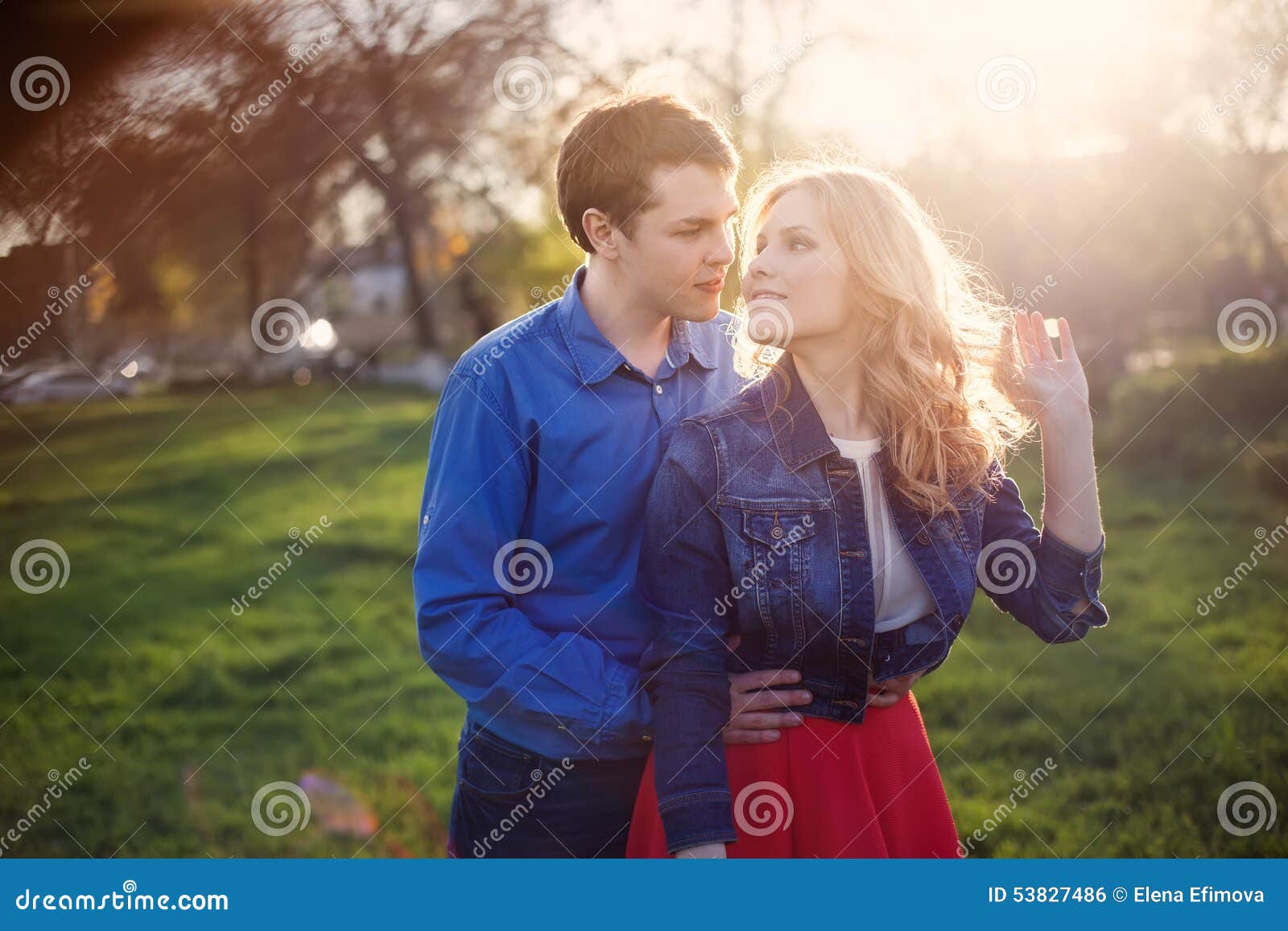 Couple Hugging in the Park at Sunset Stock Photo - Image of action ...