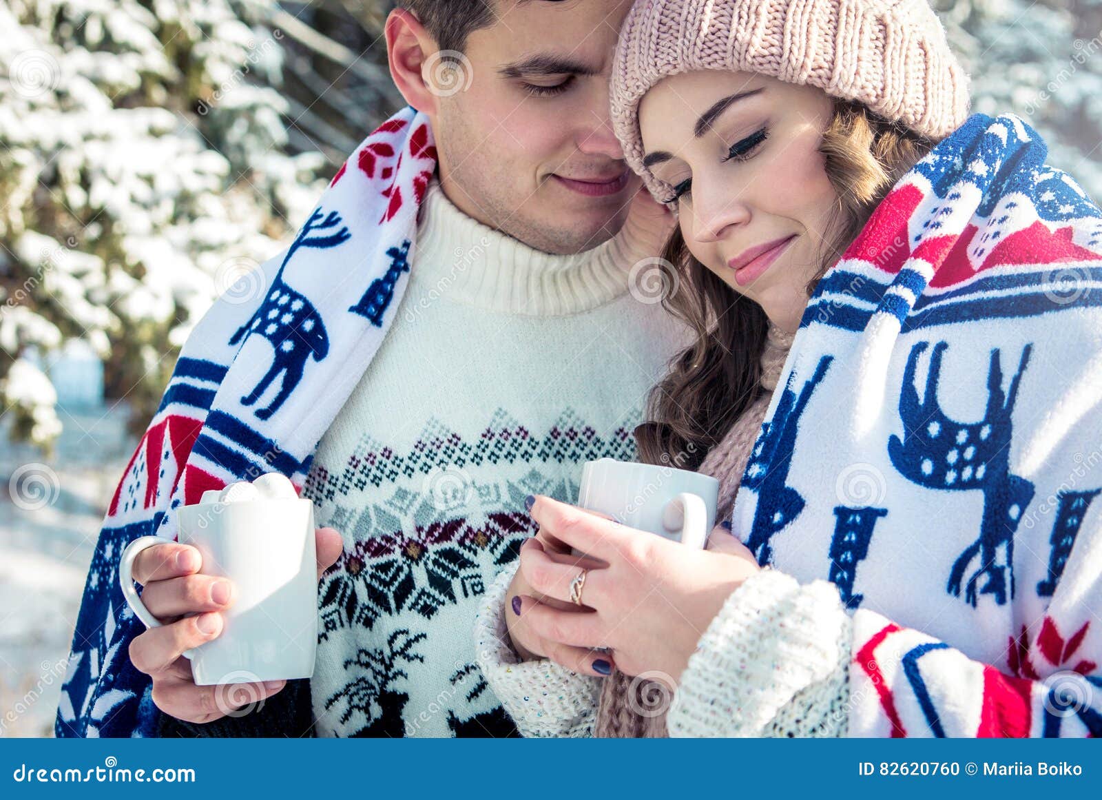 Couple Hugs and Holds Cups of Coffee with Marshmallow Stock Photo ...