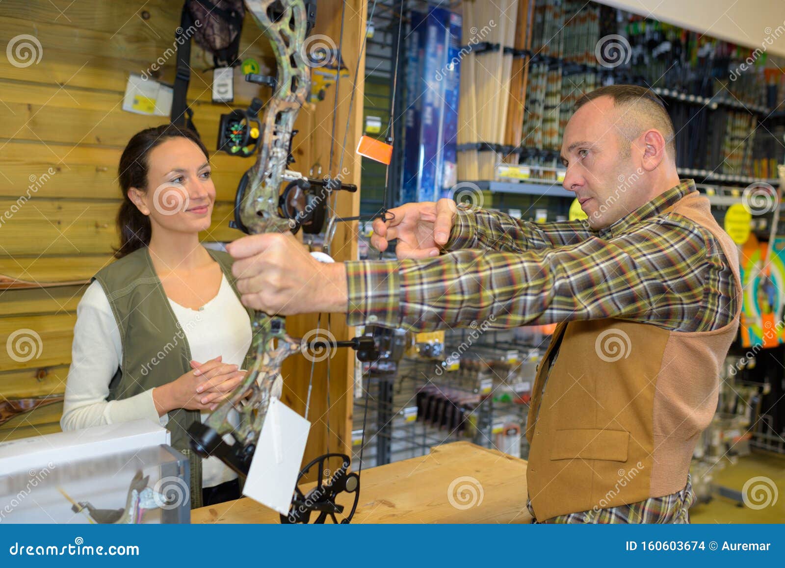 Couple at hunting store stock photo. Image of hunt, test - 160603674