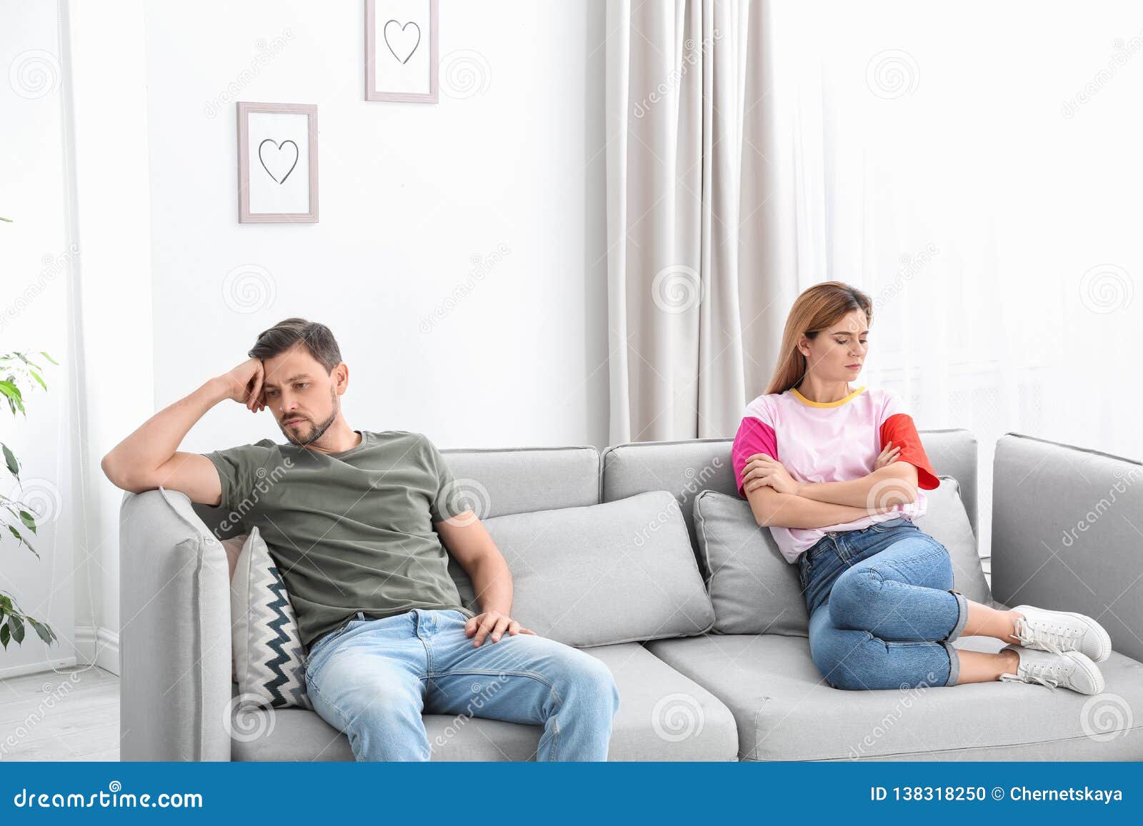 Couple Ignoring Each Other after Argument in Living Room. Stock Photo ...
