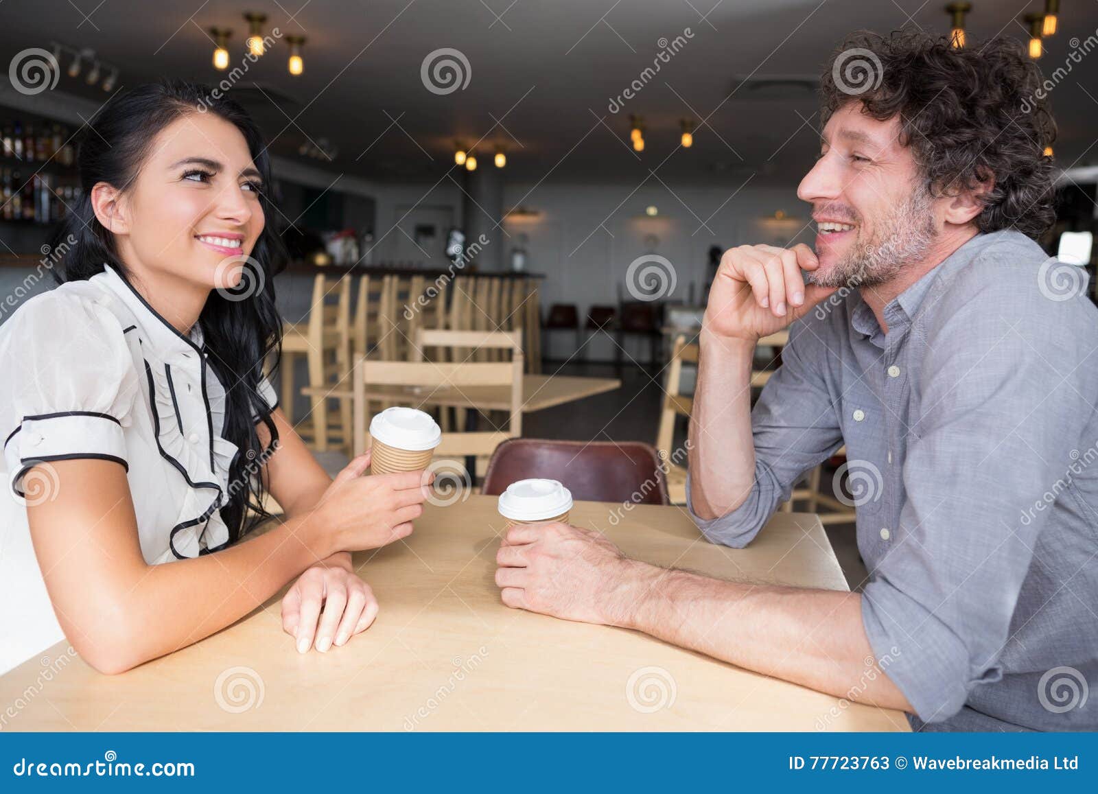 Couple Interacting with Each Other in Cafeteria Stock Image - Image of ...