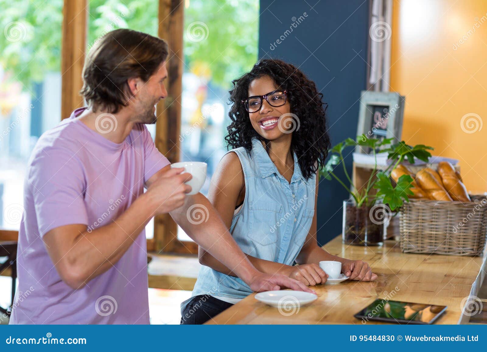 Couple Interacting with Each Other at Counter Stock Photo - Image of ...