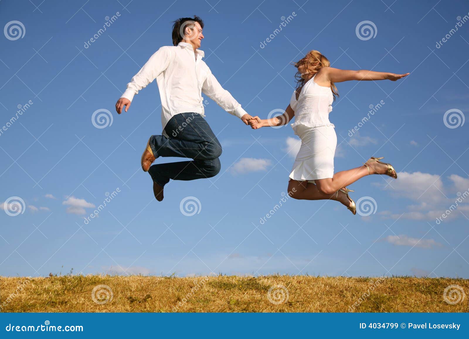 Couple jump on meadow stock image. Image of jump, pure - 4034799