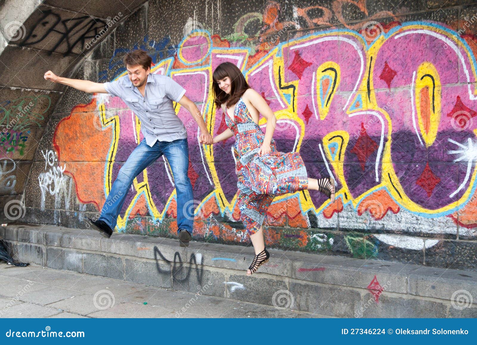 Couple Jumping Off the Ledge Editorial Stock Image - Image of ...