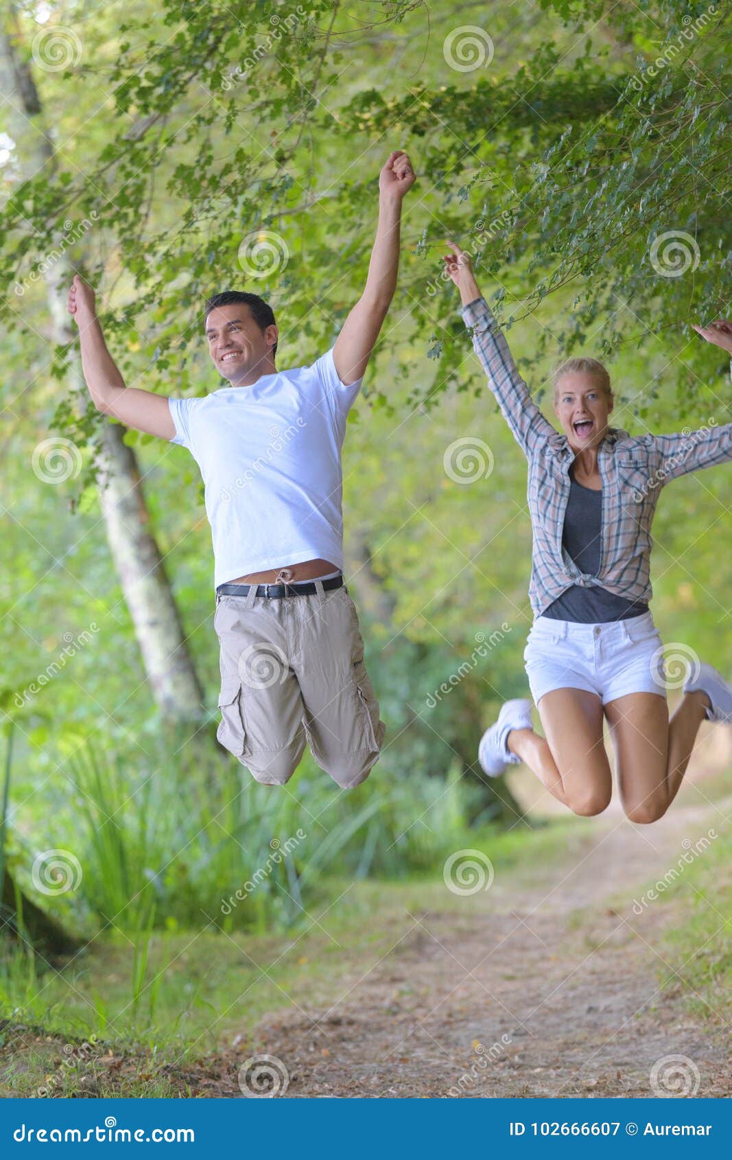 Couple jumping on path stock image. Image of blue, together - 102666607
