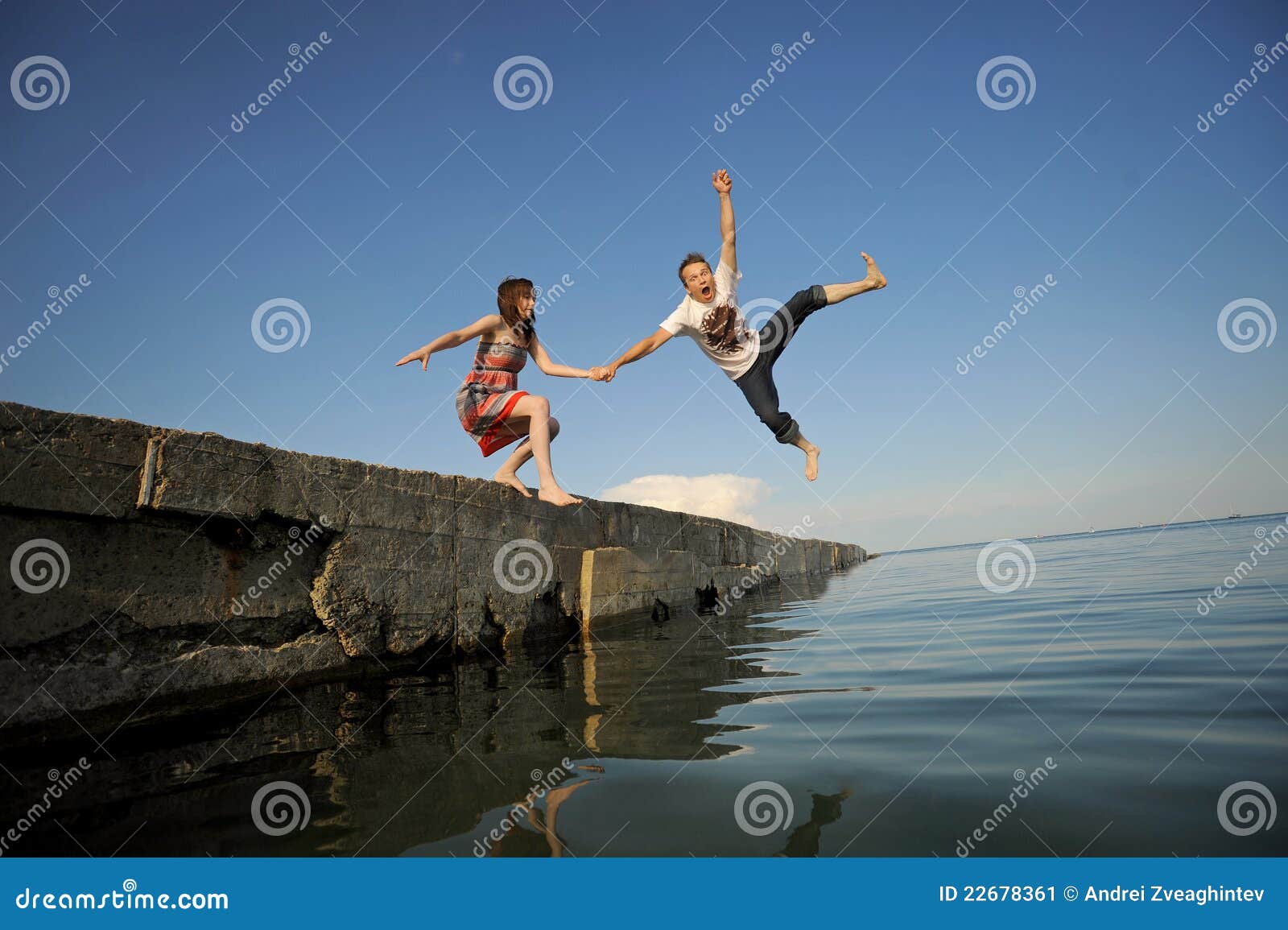 Couple jumping from a pier stock image. Image of bright - 22678361
