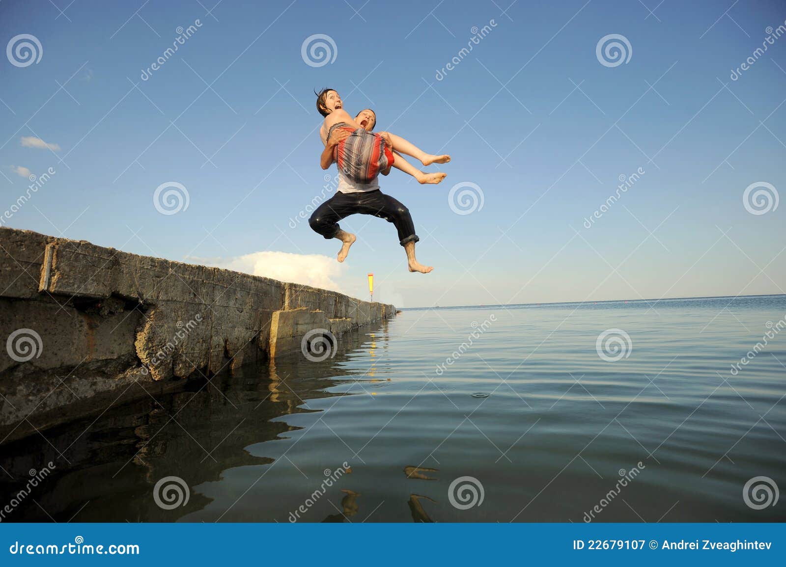 Couple jumping from a pier stock image. Image of adult - 22679107