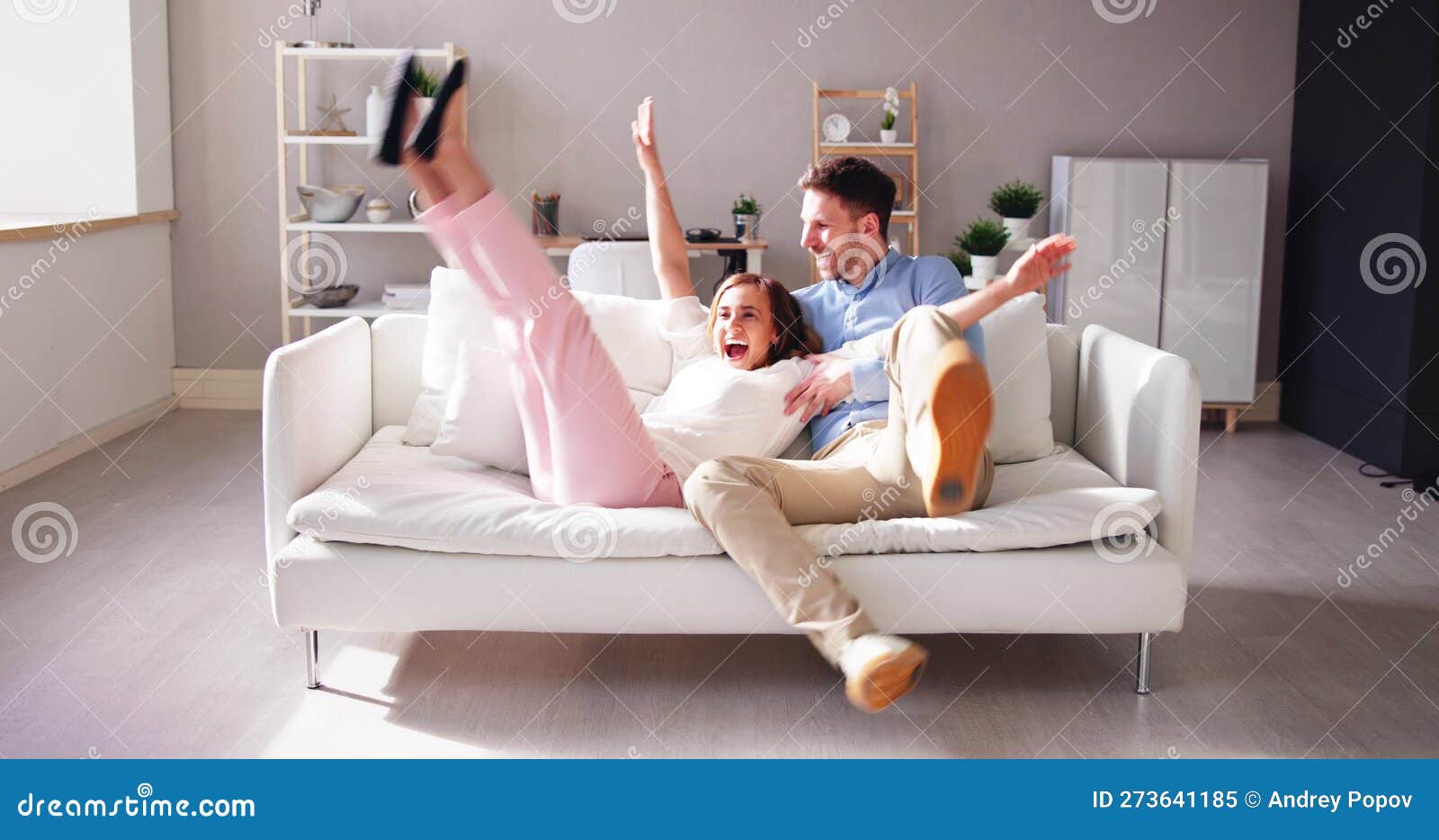 Couple Jumping on Sofa at Home Stock Image - Image of couch, enjoying ...