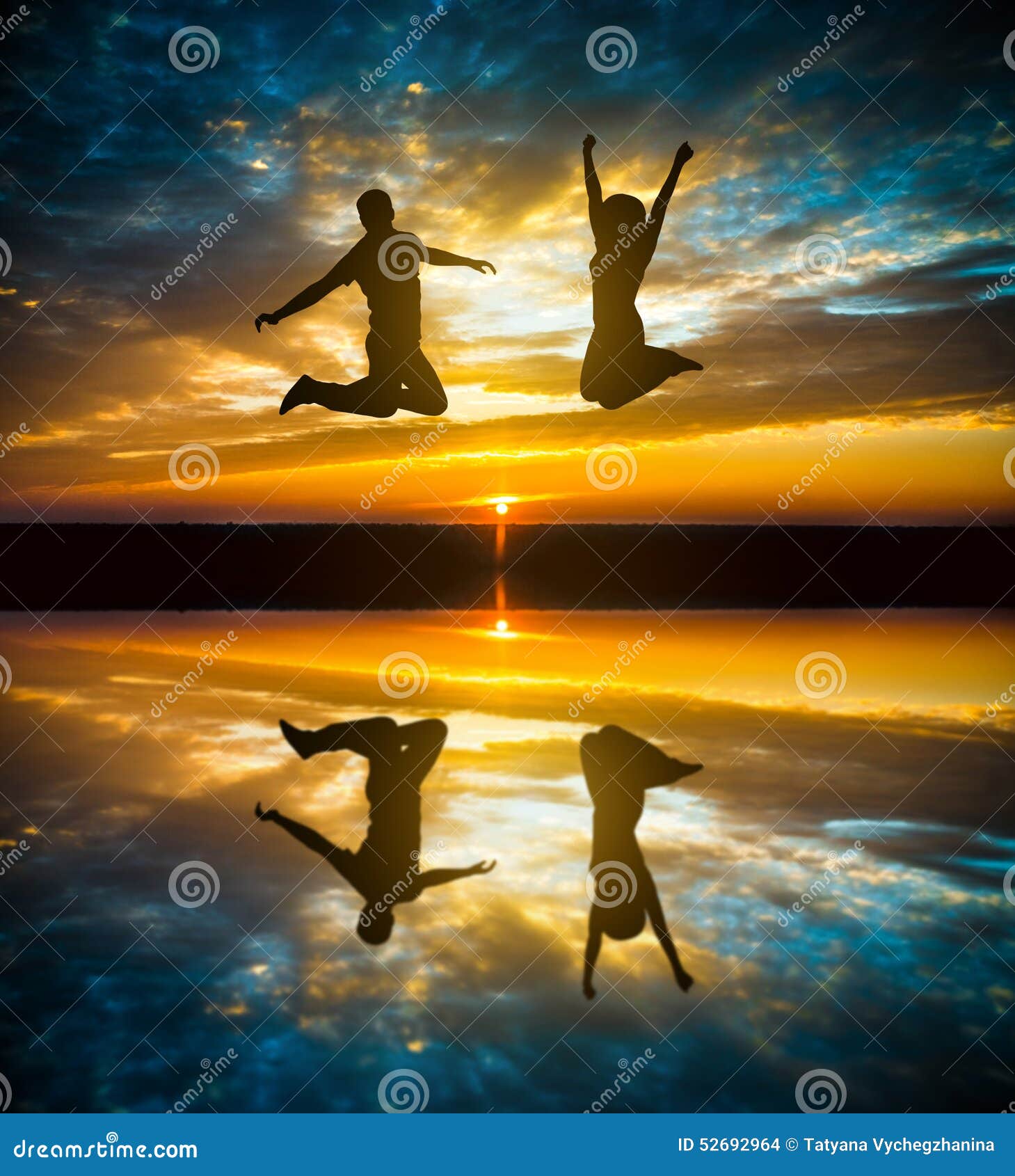 Couple jumping in sunset stock photo. Image of sunset - 52692964