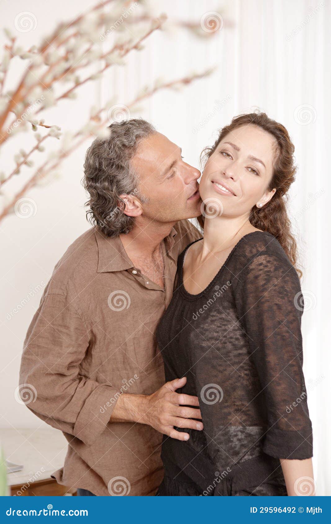 Couple kissing at home. stock photo. Image of heads, brown - 29596492