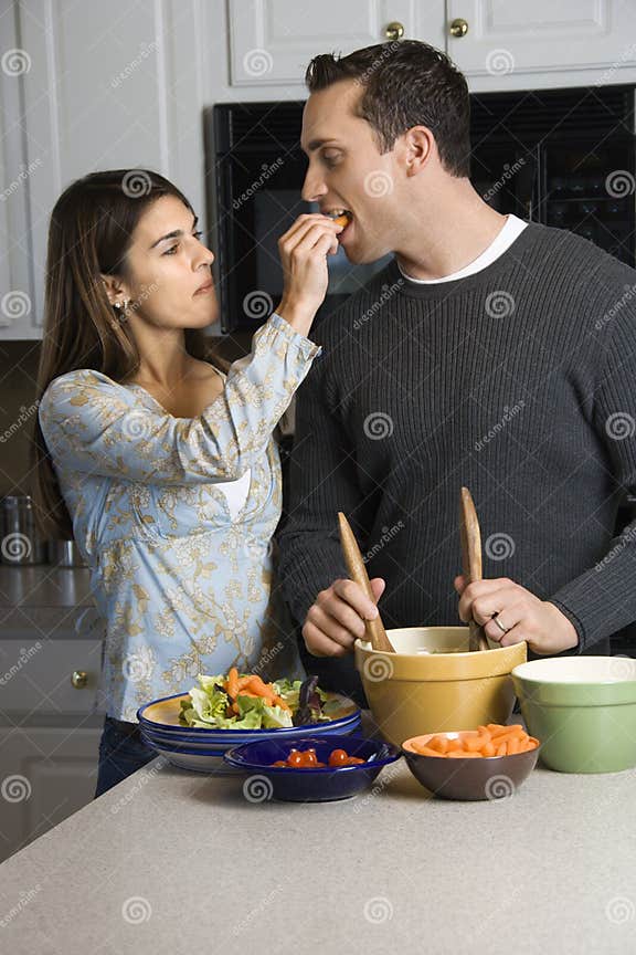 Couple in kitchen. stock image. Image of feed, healthiness - 2284539