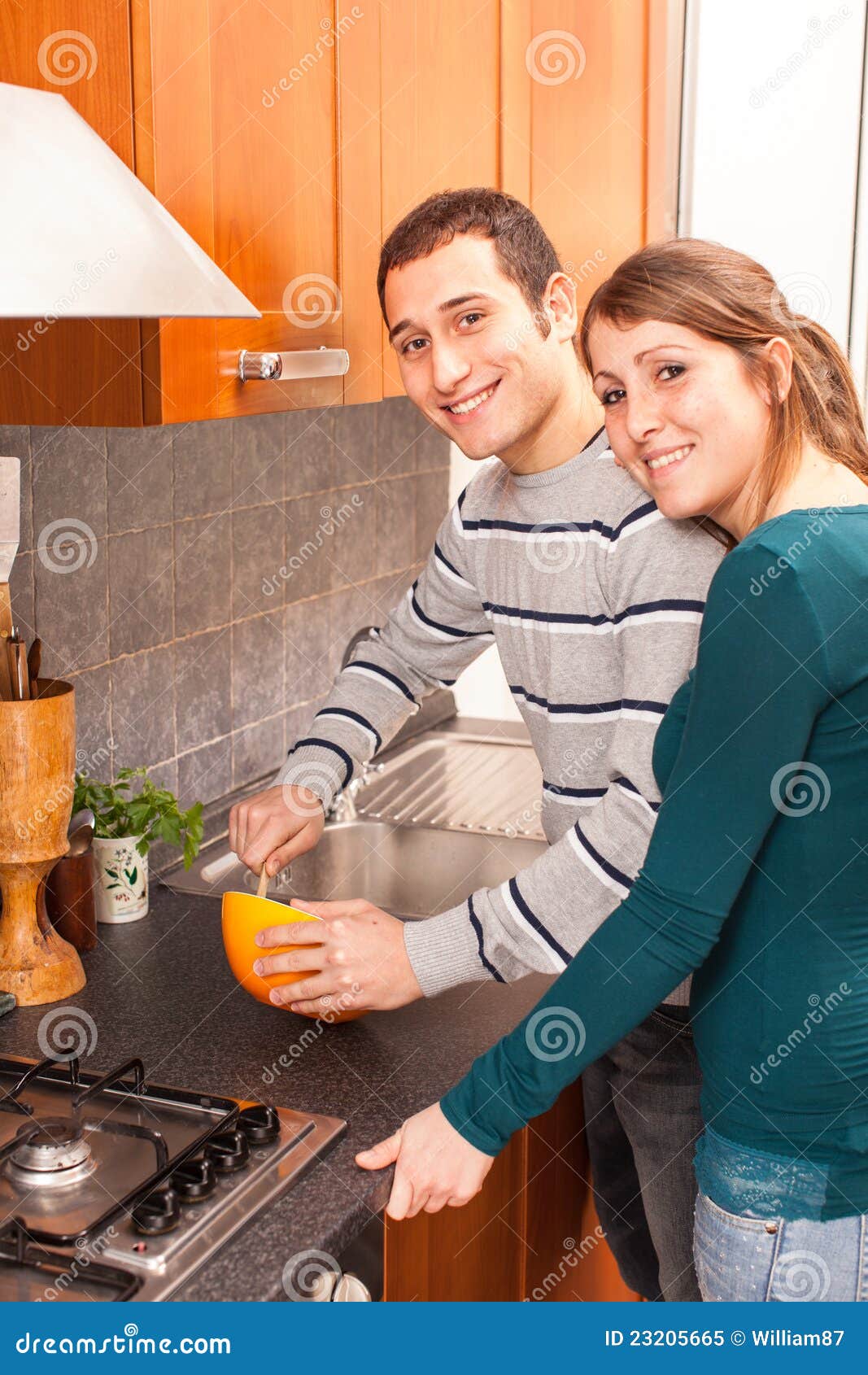 Couple in the Kitchen stock image. Image of happy, love - 23205665
