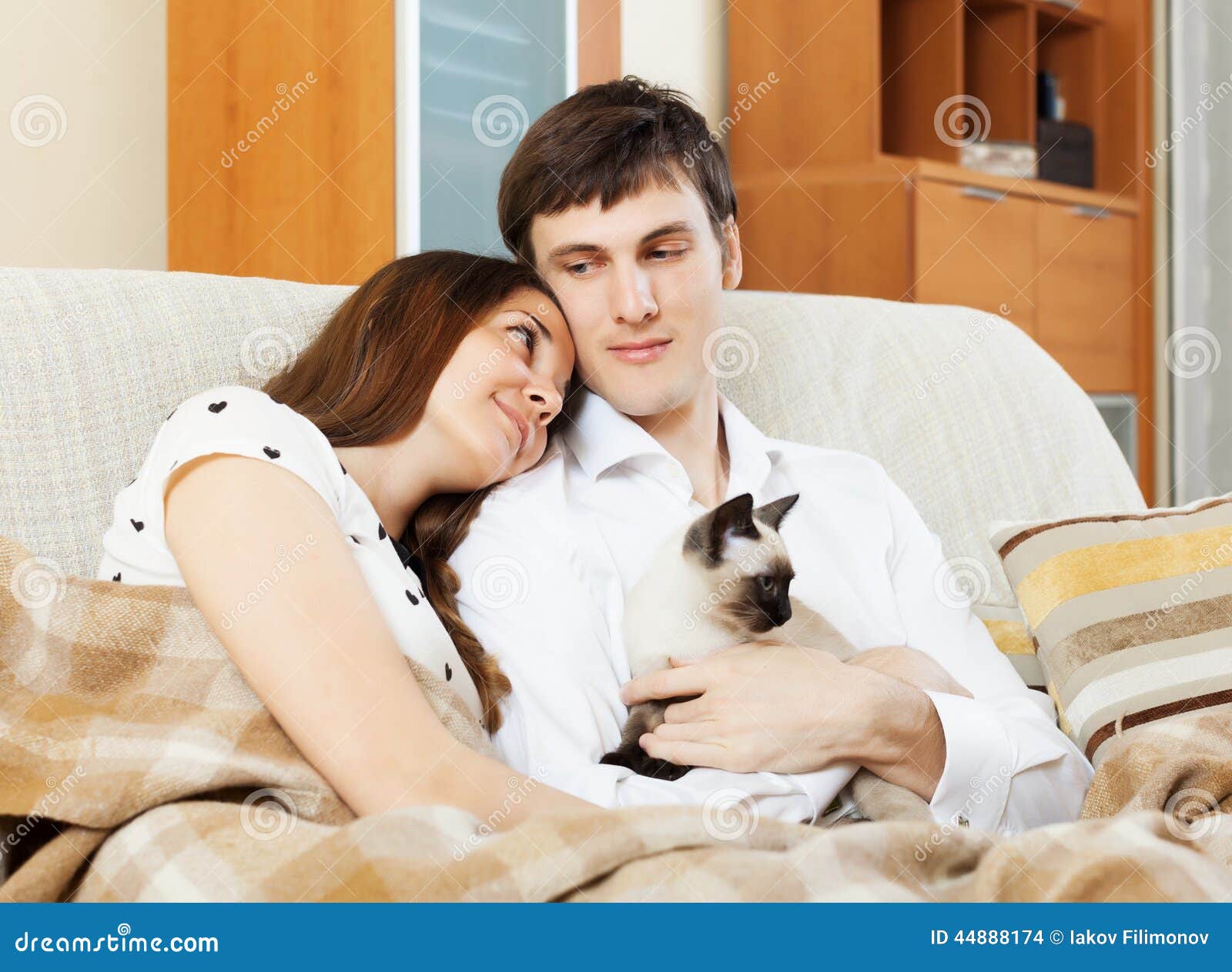 Couple with kitten stock photo. Image of husband, casual - 44888174