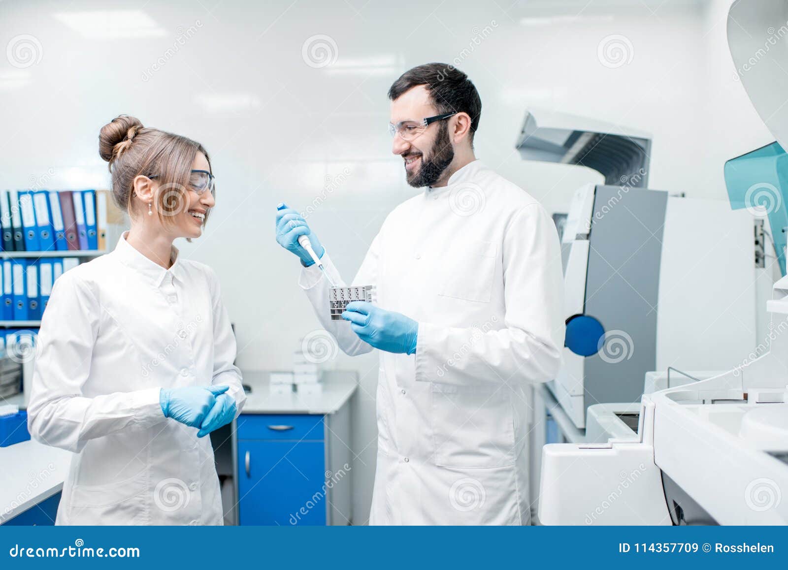 Laboratory Assistants Workign with Test Tubes Stock Image - Image of ...