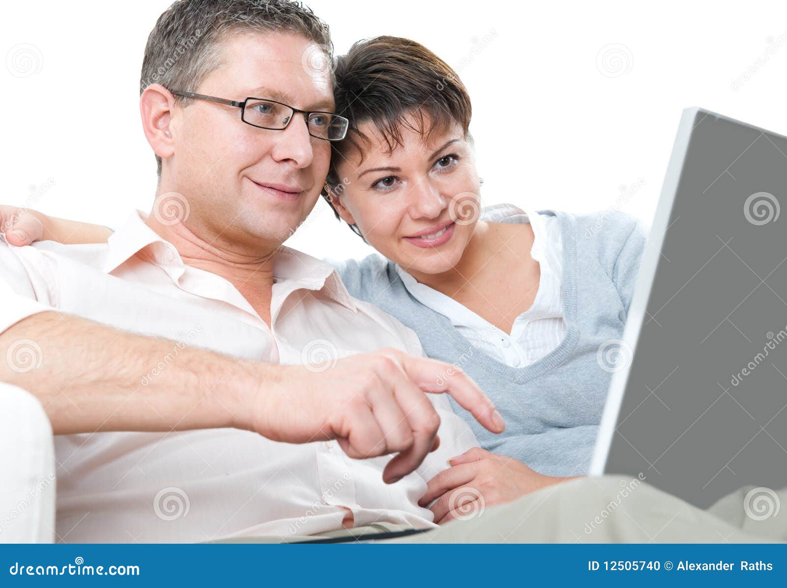 Couple on laptop stock photo. Image of leisure, embracing - 12505740