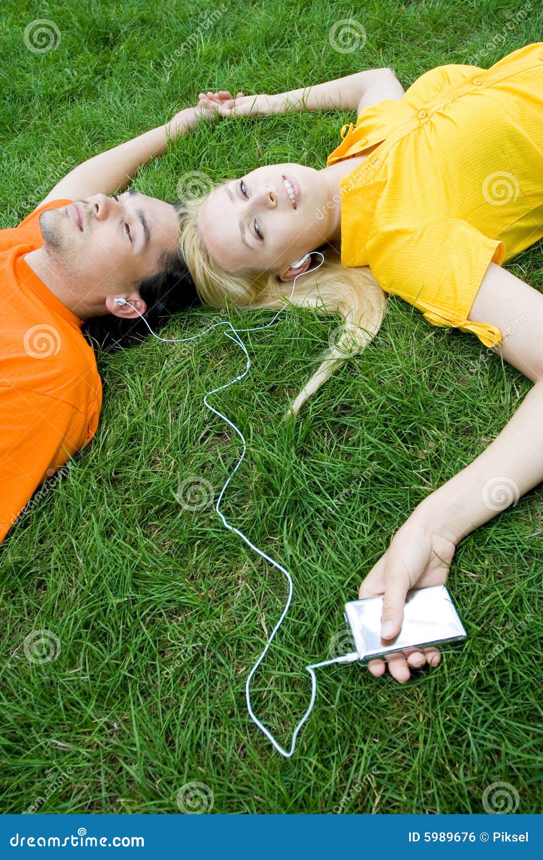 Couple Listening To MP3 Player Stock Photo - Image of player, green ...