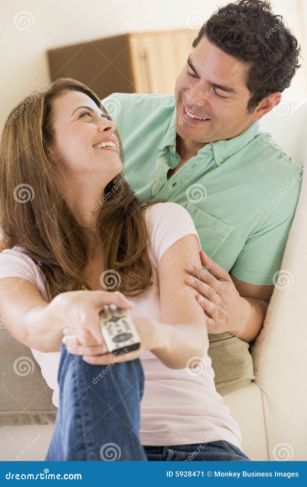 Couple in Living Room with Remote Control Stock Image - Image of ...