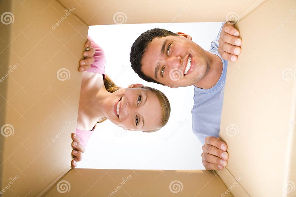 Couple lookin into box stock image. Image of domestic - 6501449