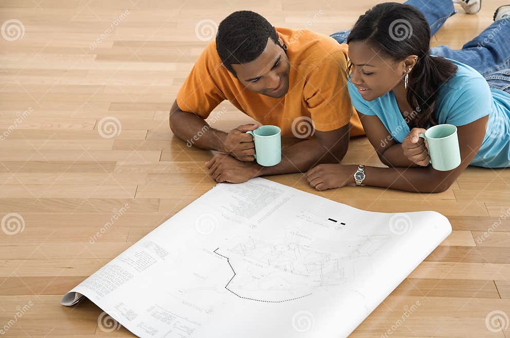 Couple Looking at Blueprints. Stock Image - Image of people, blueprint ...