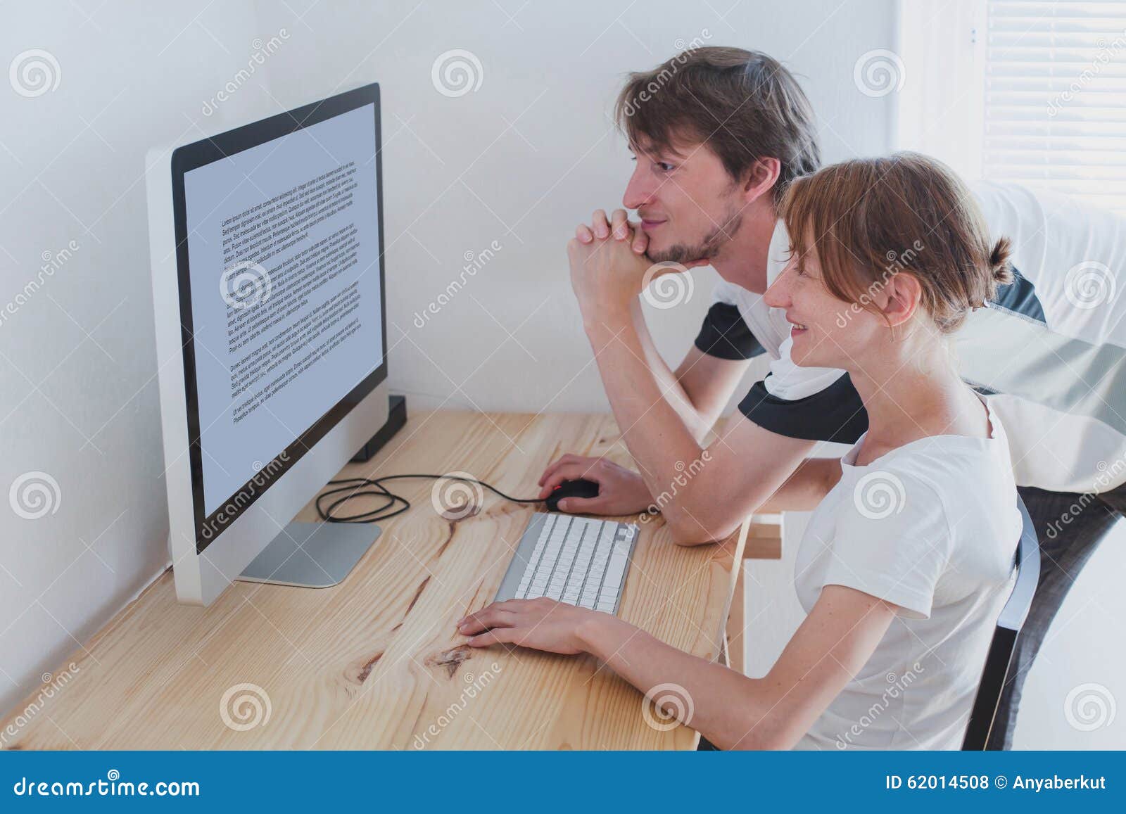Couple looking at computer stock photo. Image of interior - 62014508