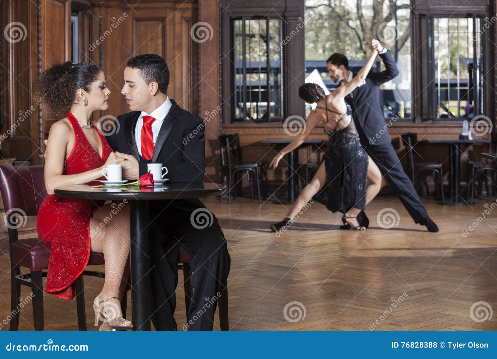 Couple Looking at Each Other while Tango Partners Performing Stock ...