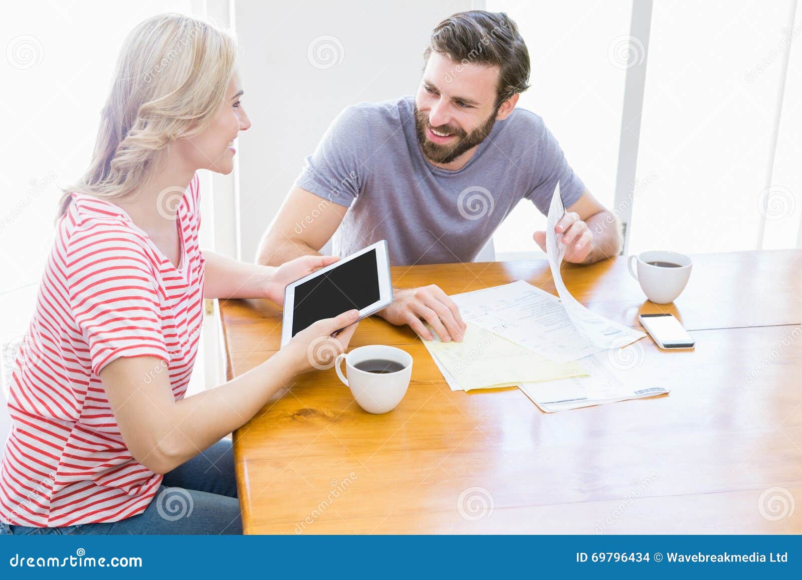 Couple Looking at Each Other while Using Digital Tablet Stock Photo ...