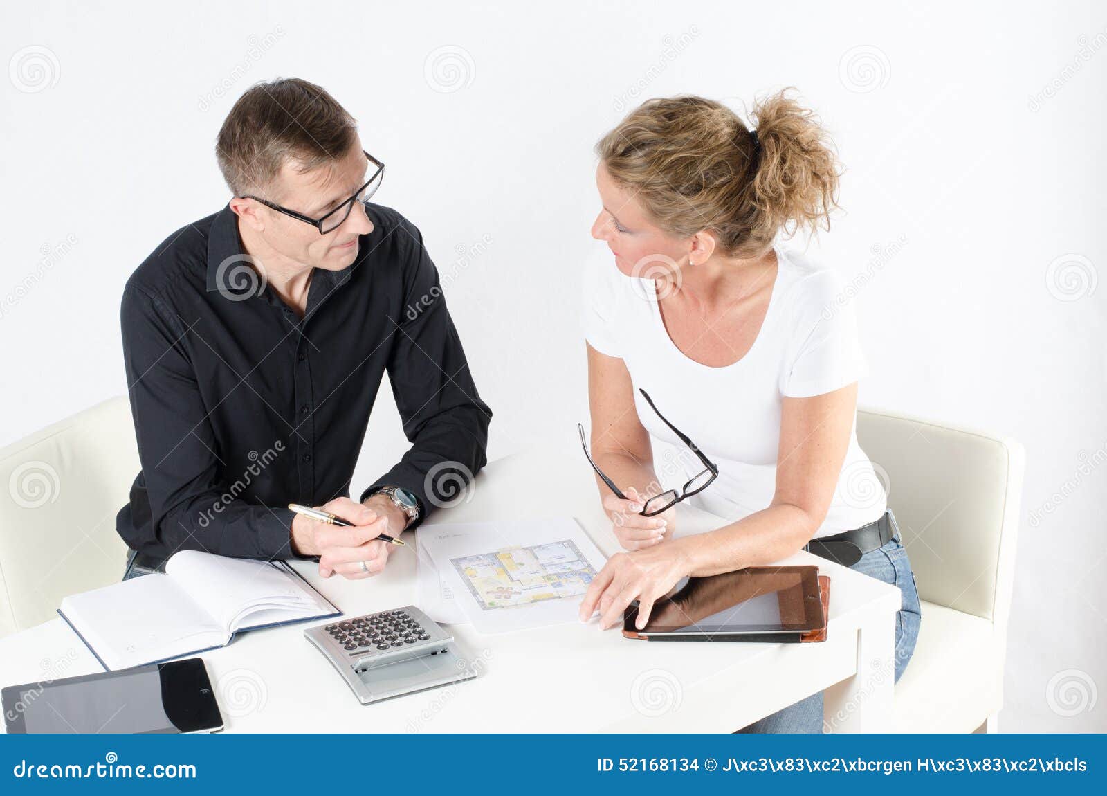 Couple Looking at Floor Plans for New Place Stock Photo - Image of ...