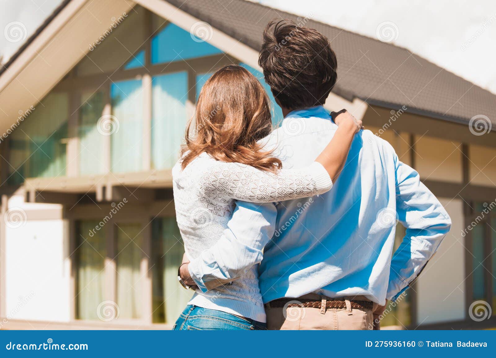 Couple looking at house stock photo. Image of looking - 275936160