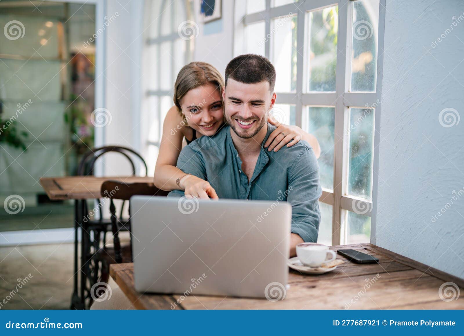 Couple Looking at Laptop Computer Together at Home. the Concept of ...