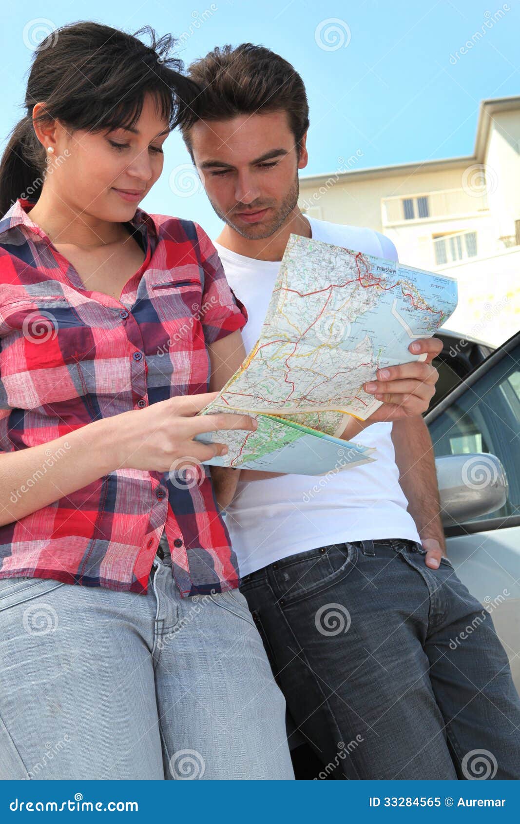 Couple looking at a map stock image. Image of door, scaled - 33284565